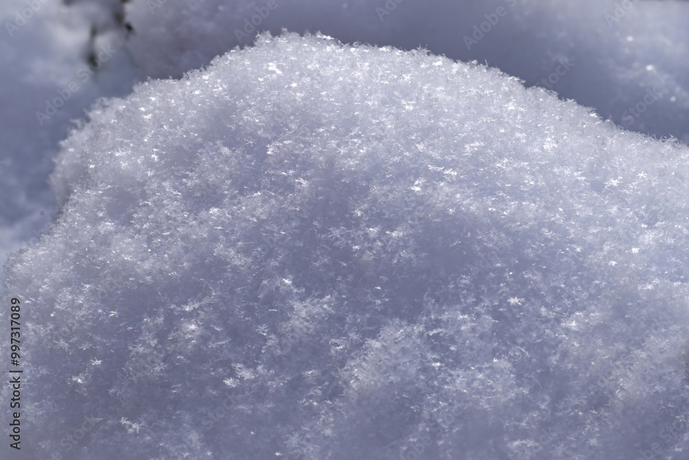 Close-up texture of fresh, clean, sparkling, freshly fallen snow ...