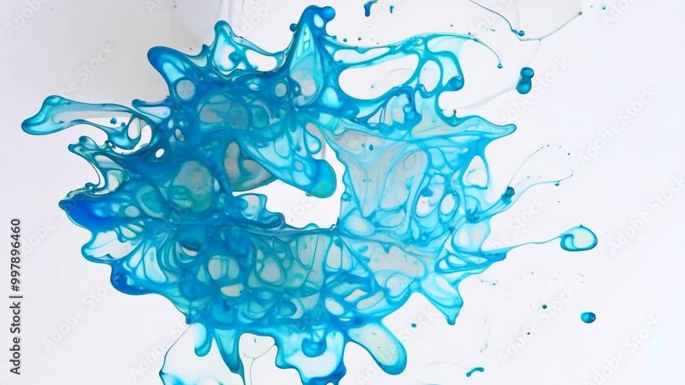 Blue liquid forms a perfect circle while rotating, then bursts ...
