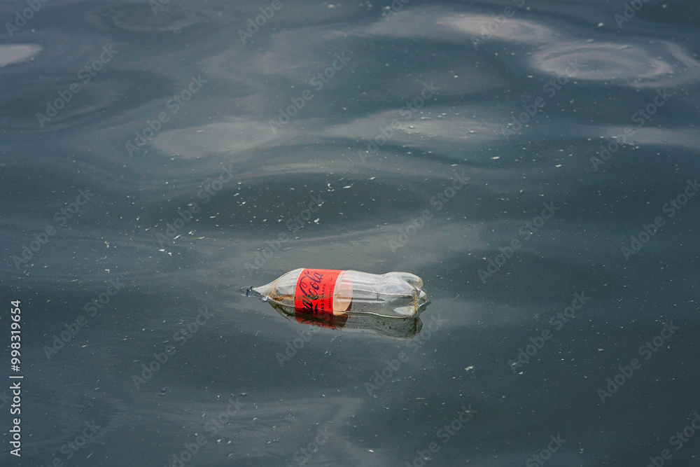 Minsk, Belarus. Jun 26, 2024. Plastic bottle Coca-Cola floating in ...
