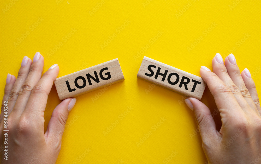 Short vs Long symbol. Concept word Short vs Long on wooden blocks ...