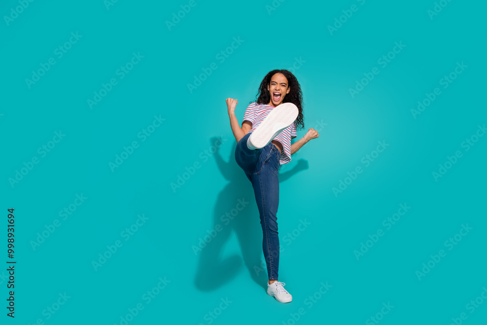 Full size photo of pretty young girl kick leg scream fighting wear ...