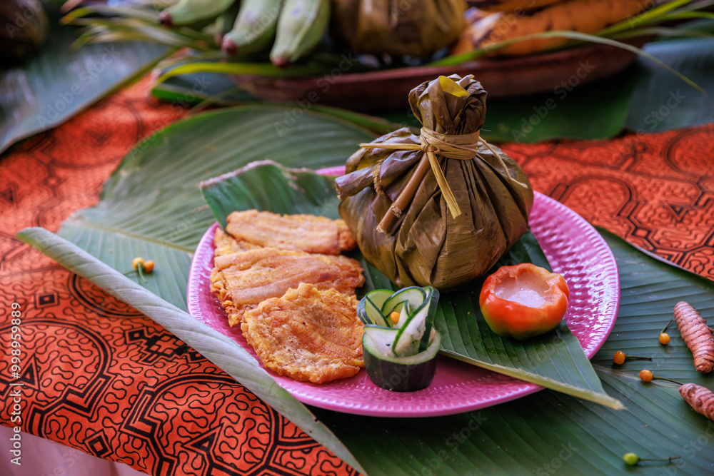 Chicken juane wrapped in bijao leaves. Food, fruits and drinks of the ...