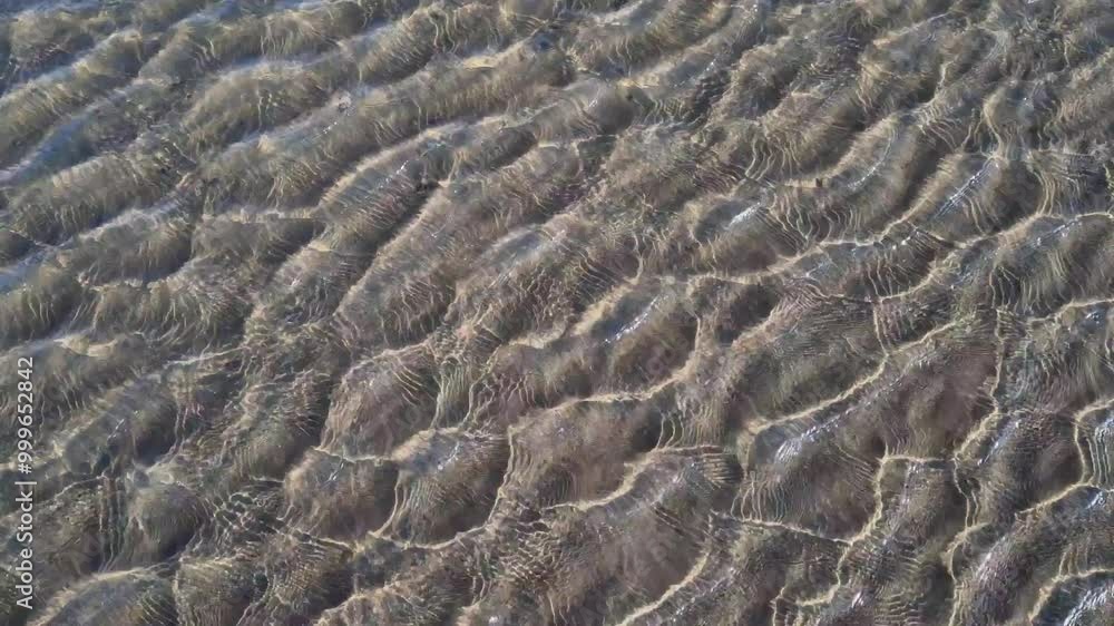 Water surface texture on sand, clean white sands ripples and wave ...