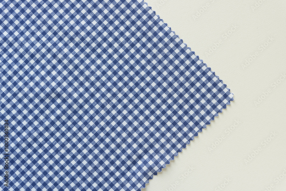 corner of a cotton fabric square with pinked edges on paper Stock Photo ...