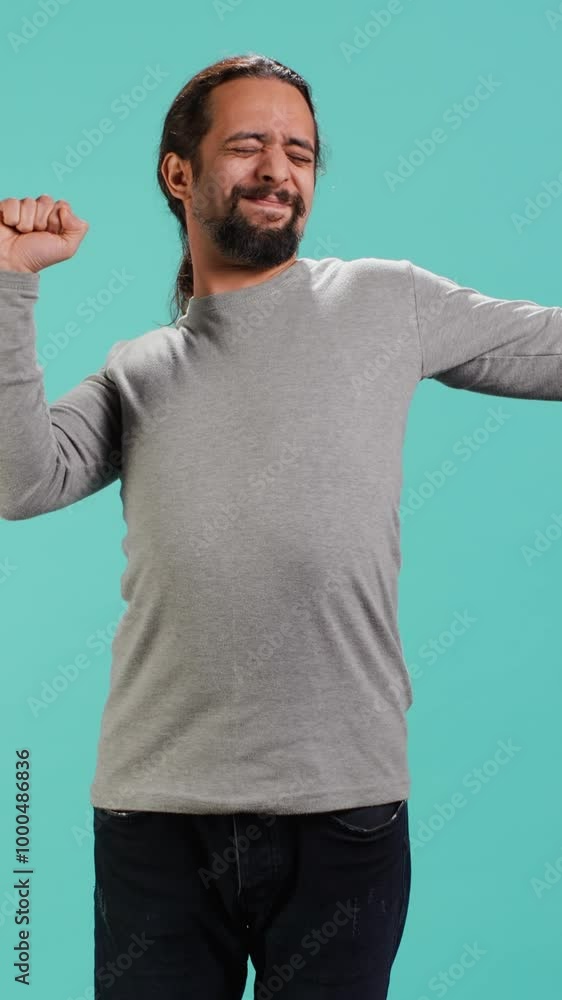 Vertical video Portrait of man stretching his body, experiencing ...