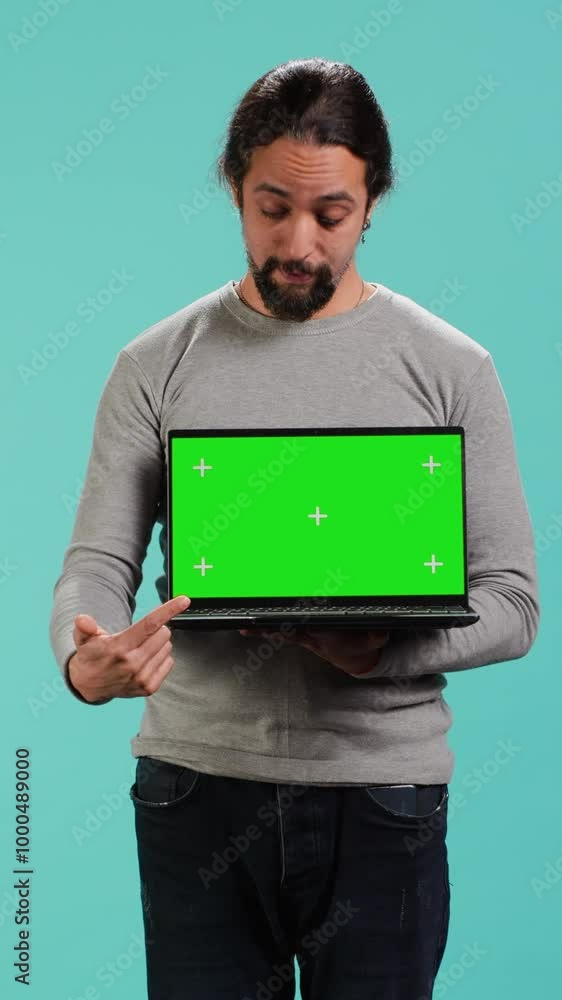 Vertical video Portrait of worker holding isolated screen laptop, doing ...