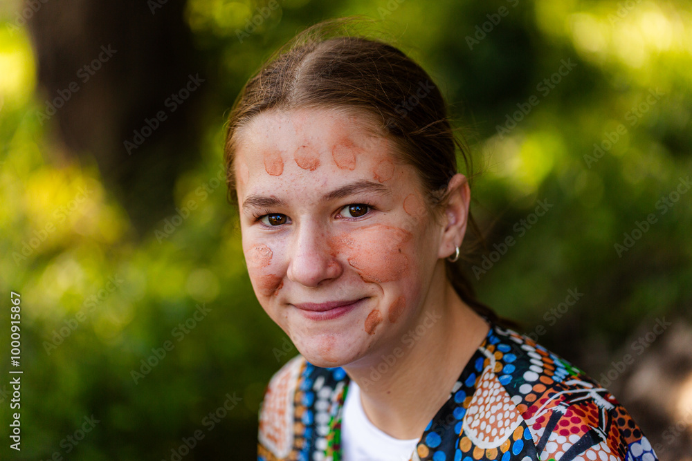 Portrait of pre-teen First Nations Australian girl in traditional ...