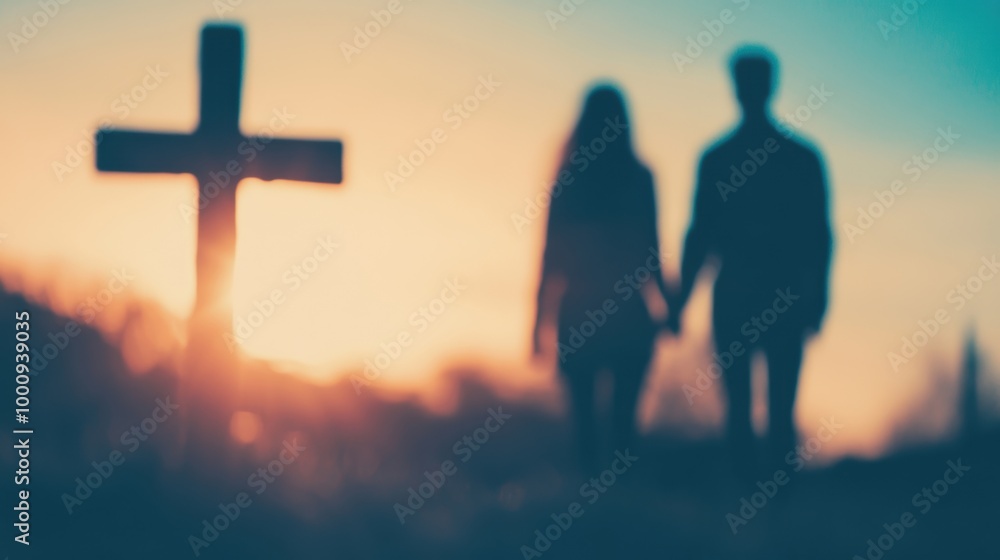 A couple strolls together, holding hands, as they approach a cross ...