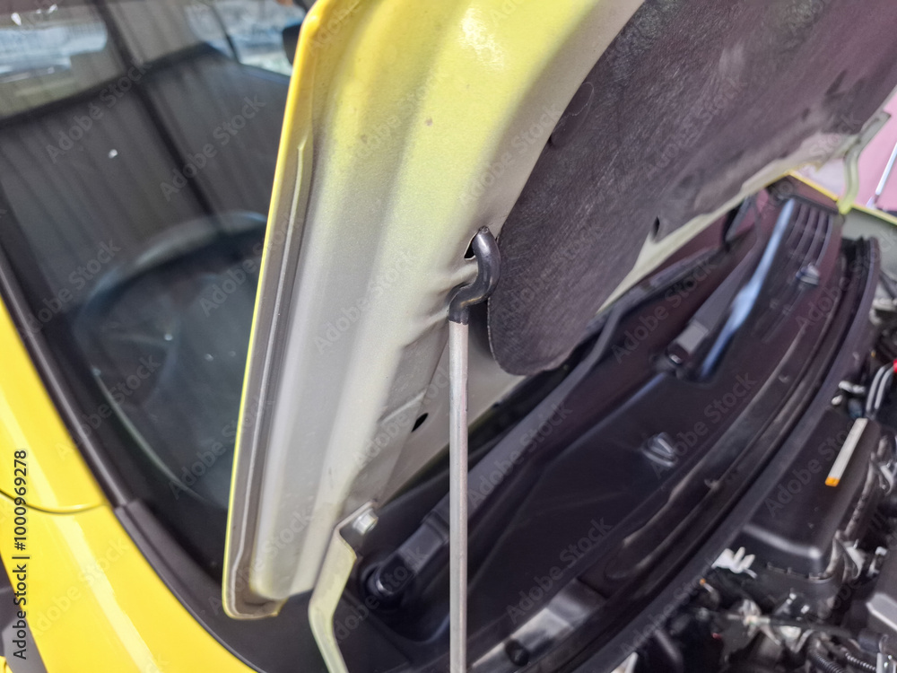 Selectively focus on the round iron rod which functions to hold the car ...