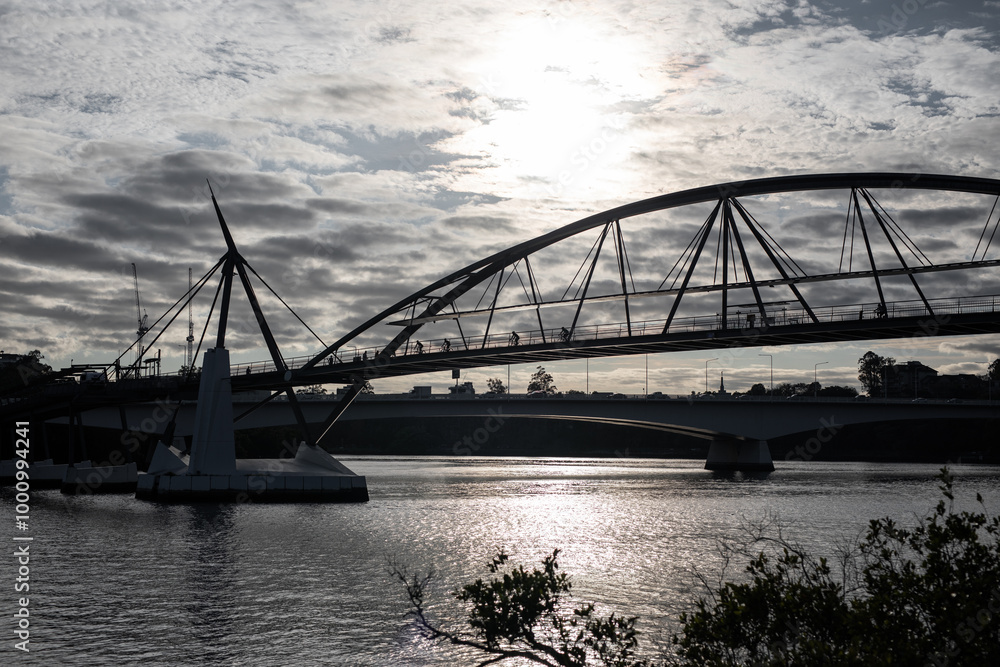 modern bridge construction river city skyline building walkway cable ...