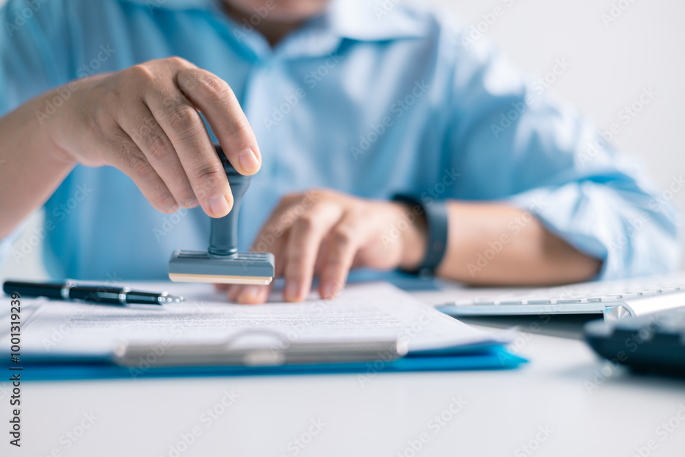 Notary placed their stamp of approval on the document as the lawyer and ...