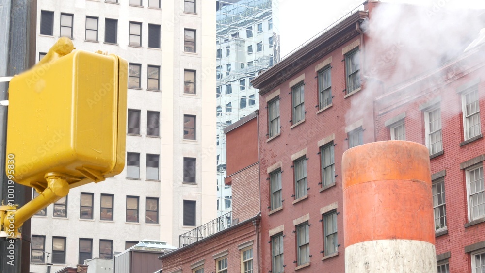 Steam vapor vented, New York City Water street, orange vapour tube ...
