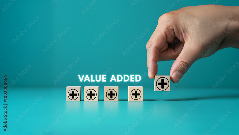 Value add concept. Hand place wooden cube with plus sign on turquoise ...