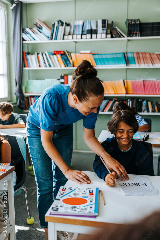 Female professor helping elementary student with creativity in drawing ...