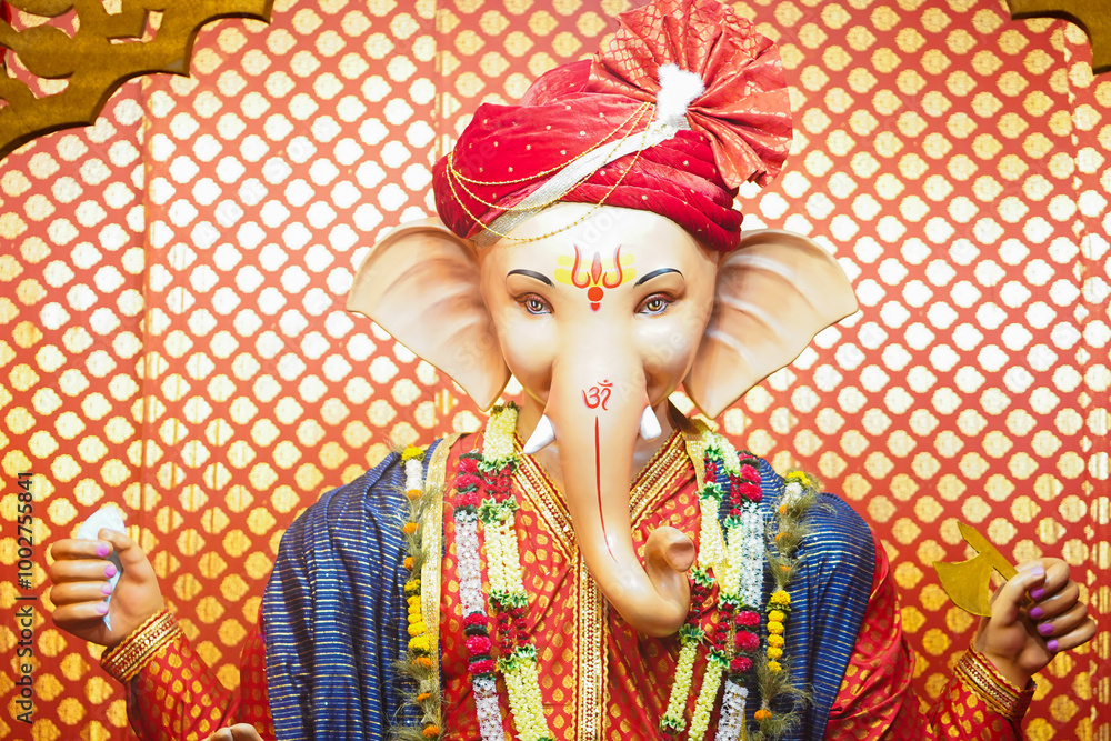 Ganesh idol adorned with traditional attire, Colorful Lord Ganesha ...
