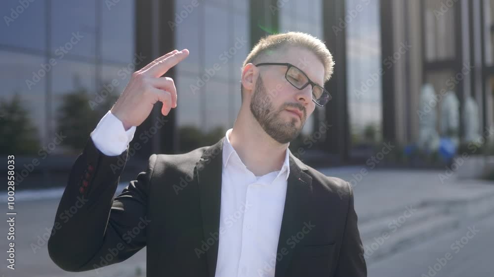 Man Making Finger Gun Gesture at His Head in a Close-Up Shot ...