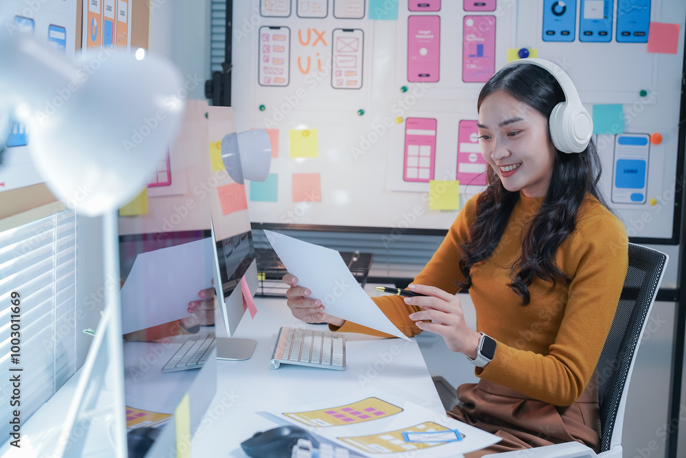 In this image, a talented ui/ux designer, who is a woman of asian ...