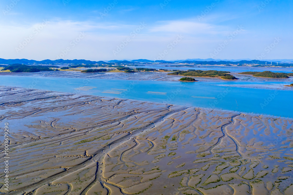 Aerial view of mud flats of the sea near Taepyeong Salt Farm at Jeungdo ...