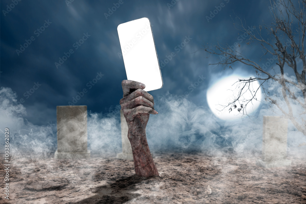 Zombie hand with bloody wound rising out of ground holding mobile phone ...