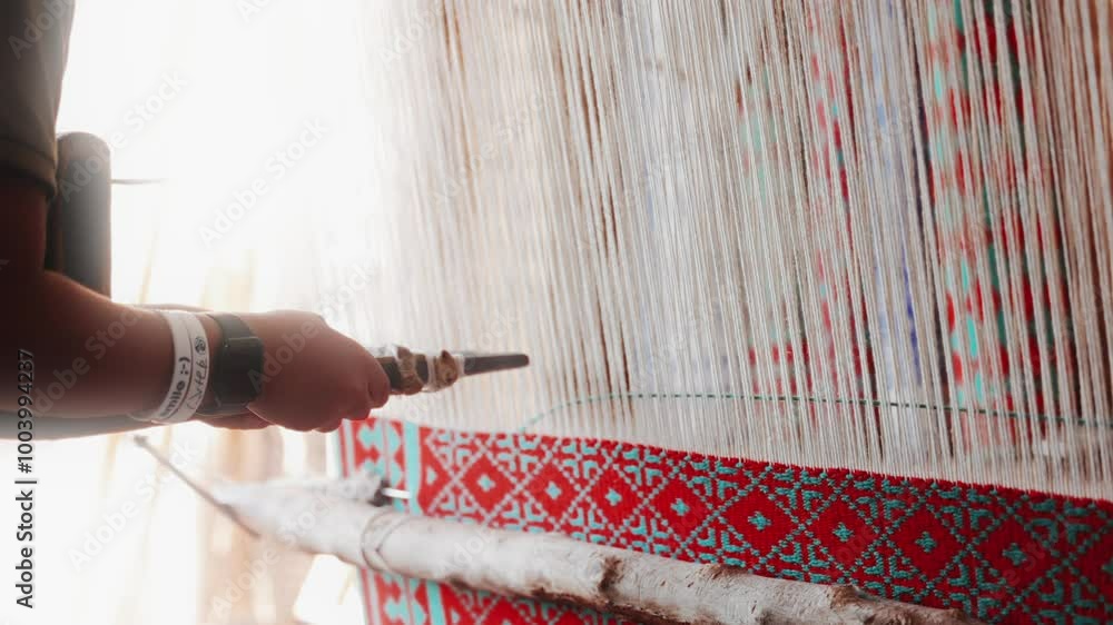 Hand loom, ancient carpets production technique. Working on a handloom ...