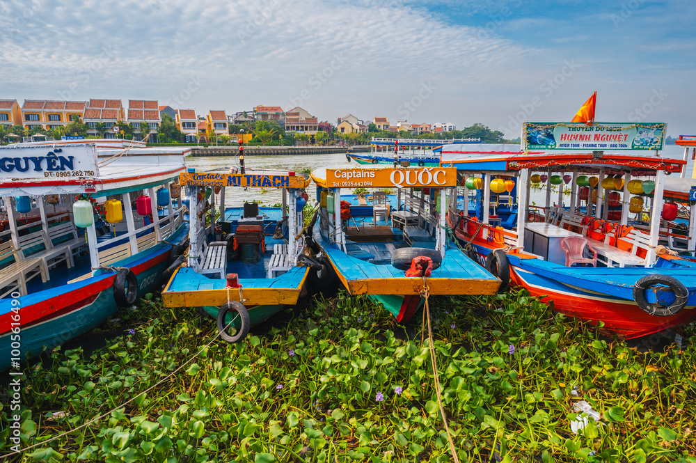 Traditional wooden Vietnamese boats on the Thu Bon River in the old ...