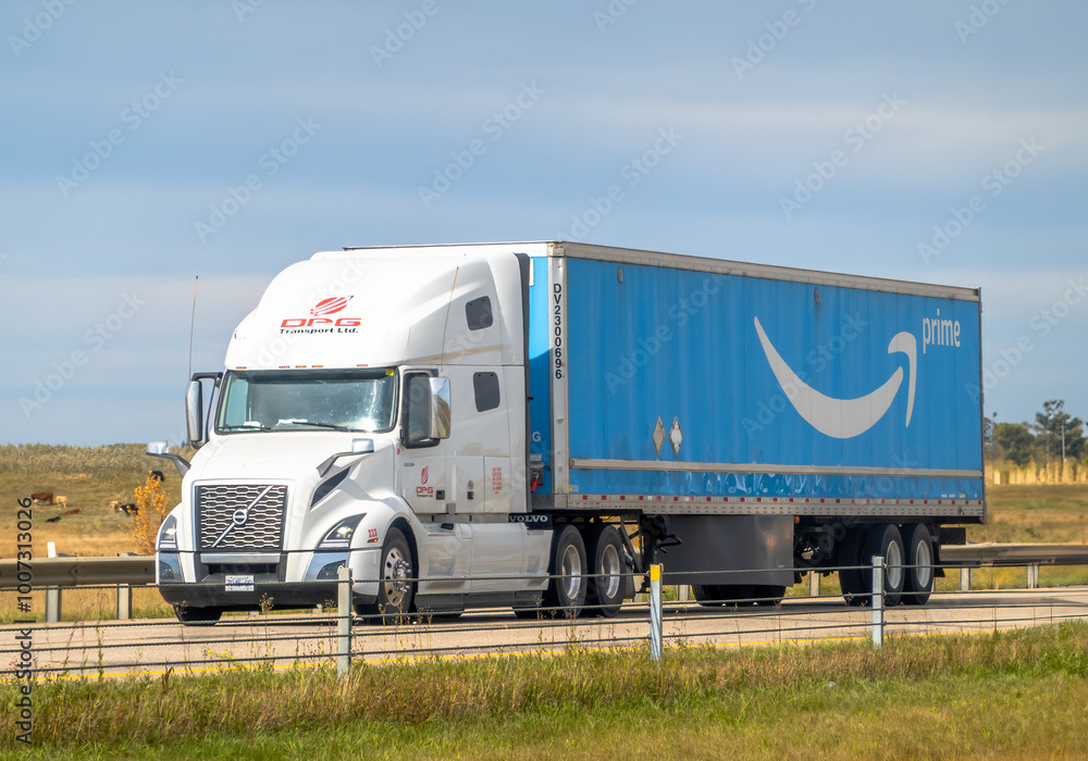 Calgary, Alberta, Canada. Oct 2, 2024. A white semi truck hauls a large ...