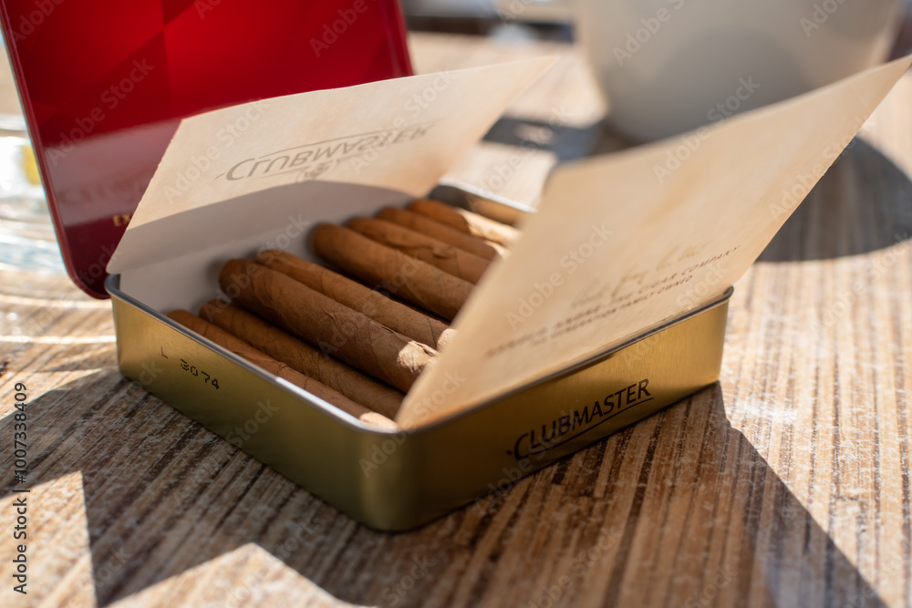 Cigarillos Clubmaster Mini in metal box close-up on table in open air ...
