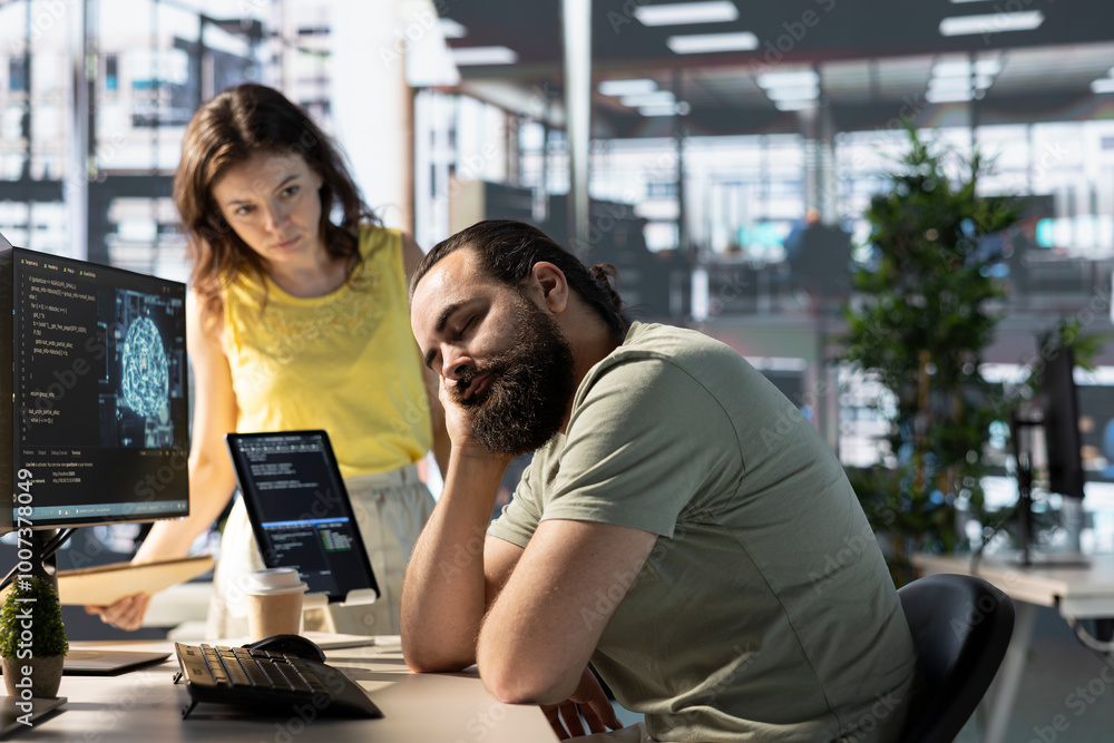 Programmer caught asleep at desk by manager while developing AI machine learning APIs solving ...