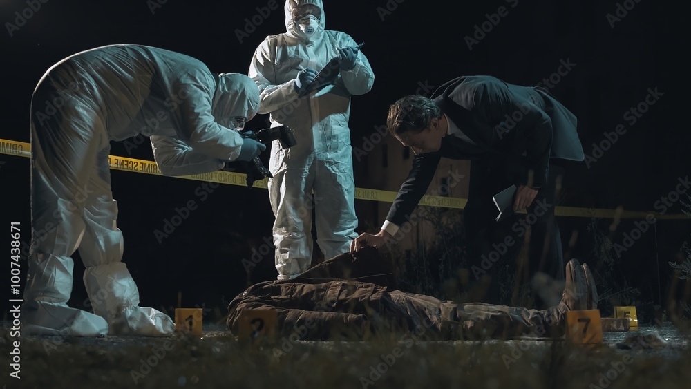 Detective and forensic scientists working hard at crime scene near ...