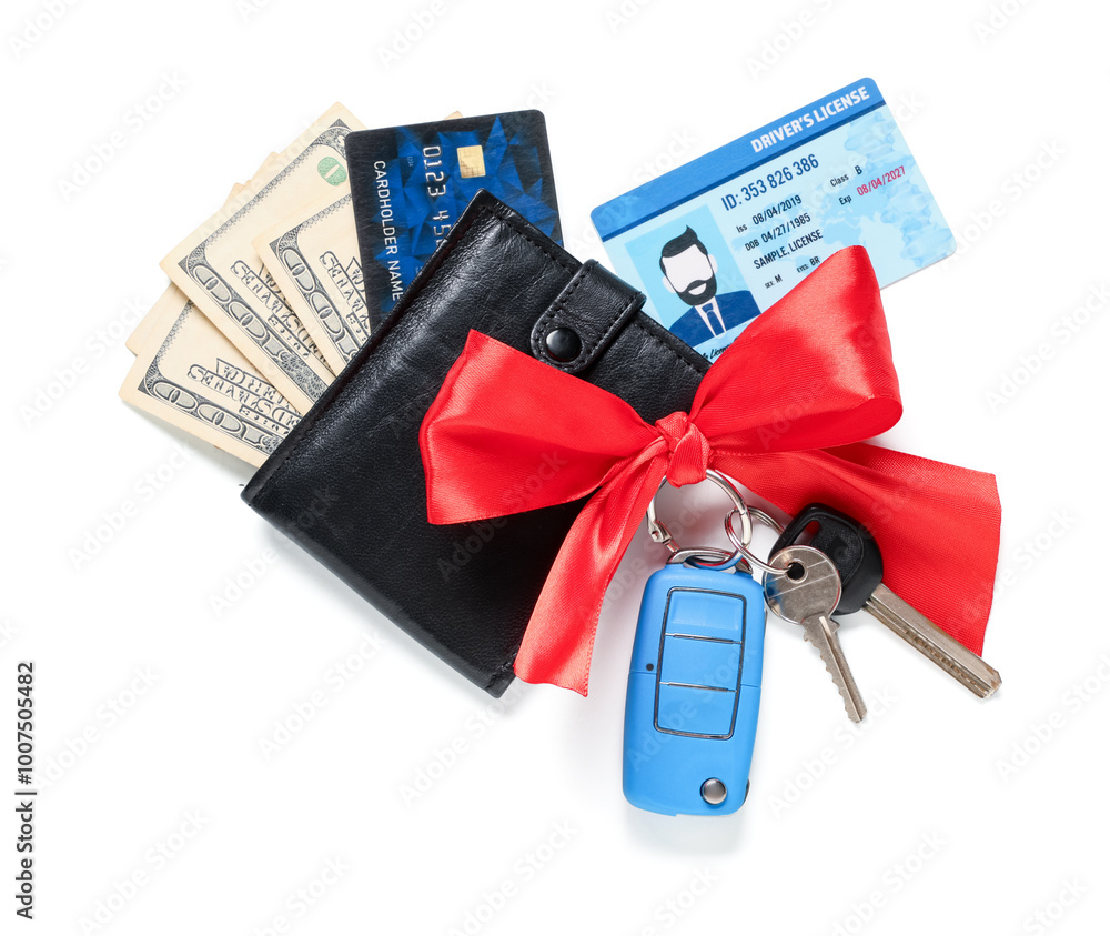 Gift keys of new car with red bow, wallet, driver license and credit card on white background ...