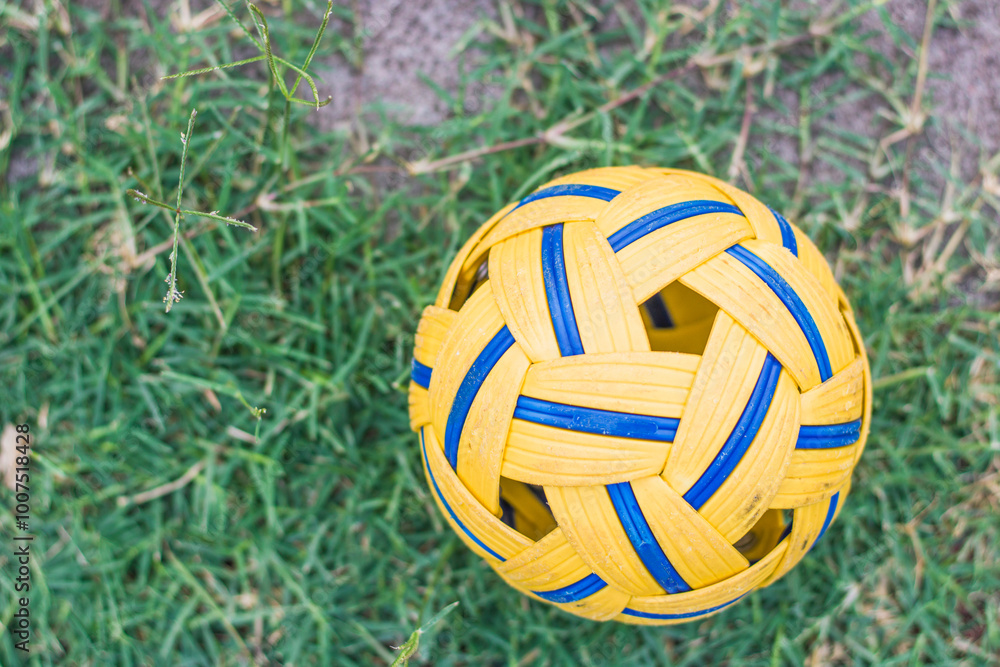 Rattan balls or takraw balls on grass block paving. Sepak takraw is a ...