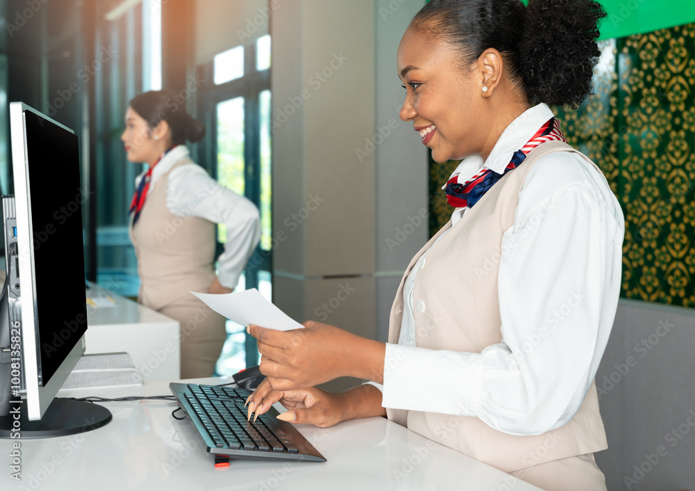 Female african officer working at airline check in service counter ...