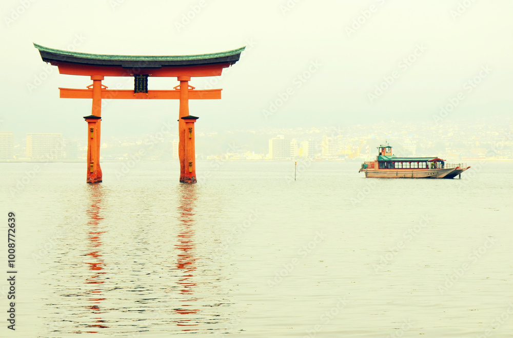 Torii gate and ferry boat at Miyajima island, Itsukushima, Hatsukaichi ...