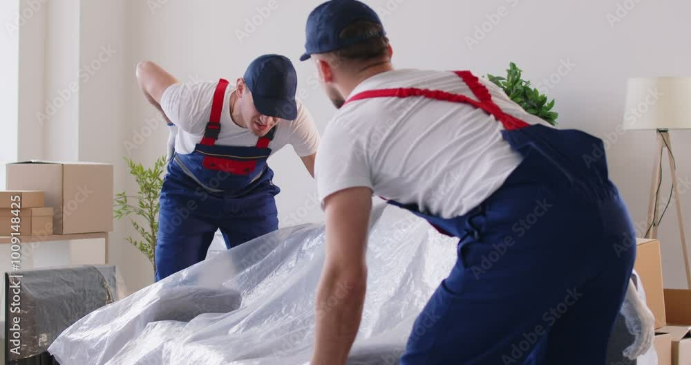 Trauma at work, heavy lifting causing bad back muscle strain, mover ...