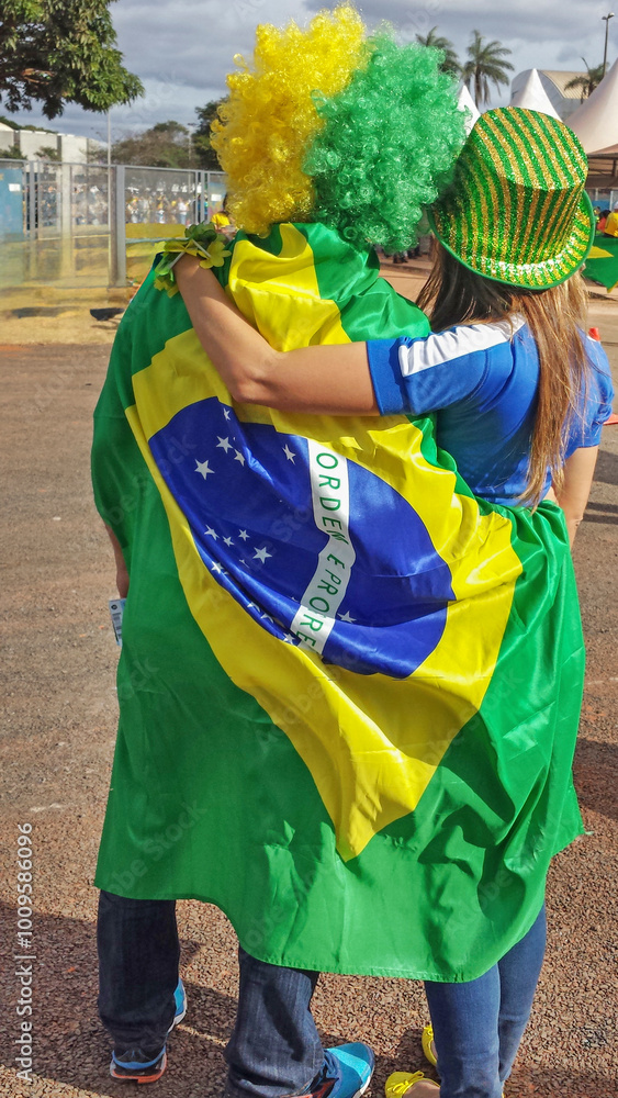 Couple of soccer fans with Brazil National Flag at National Stadium ...