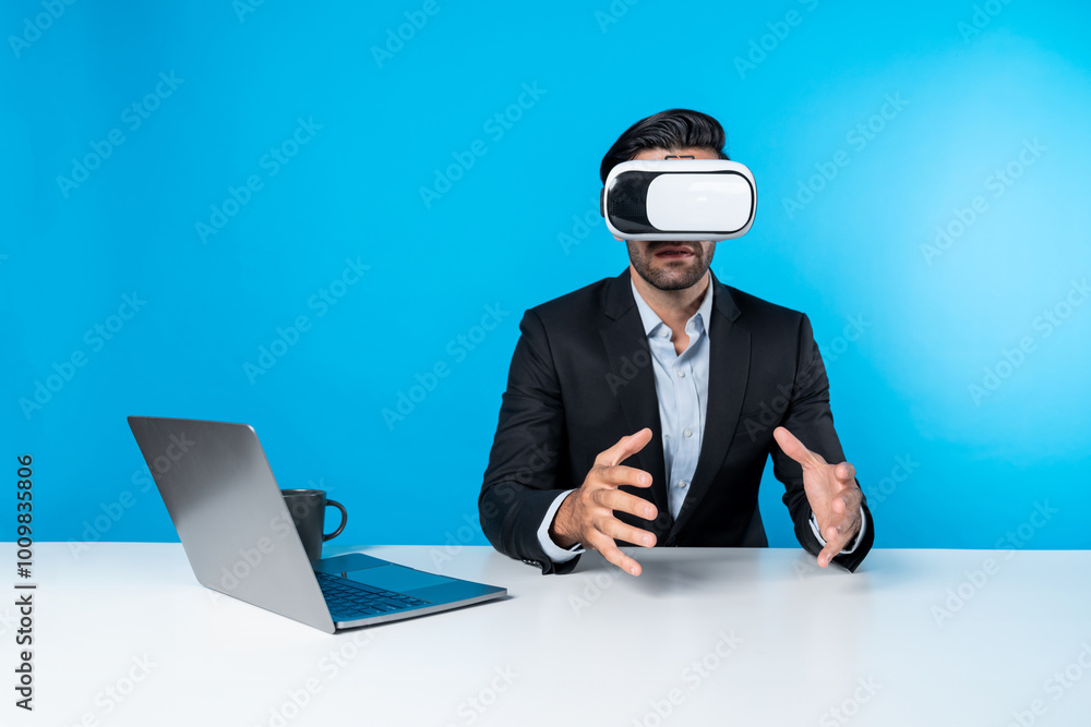 Professional project manager looking by using VR goggle while sitting ...