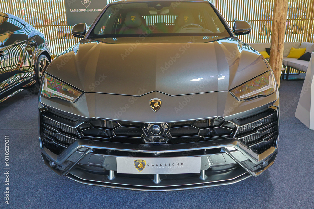 Lamborghini urus exhibiting its powerful front grill at a car ...
