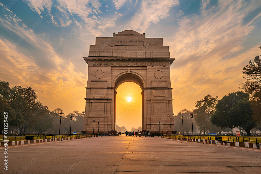 Majestic view of India Gate under a clear blue sky, symbolizing Delhi’s ...