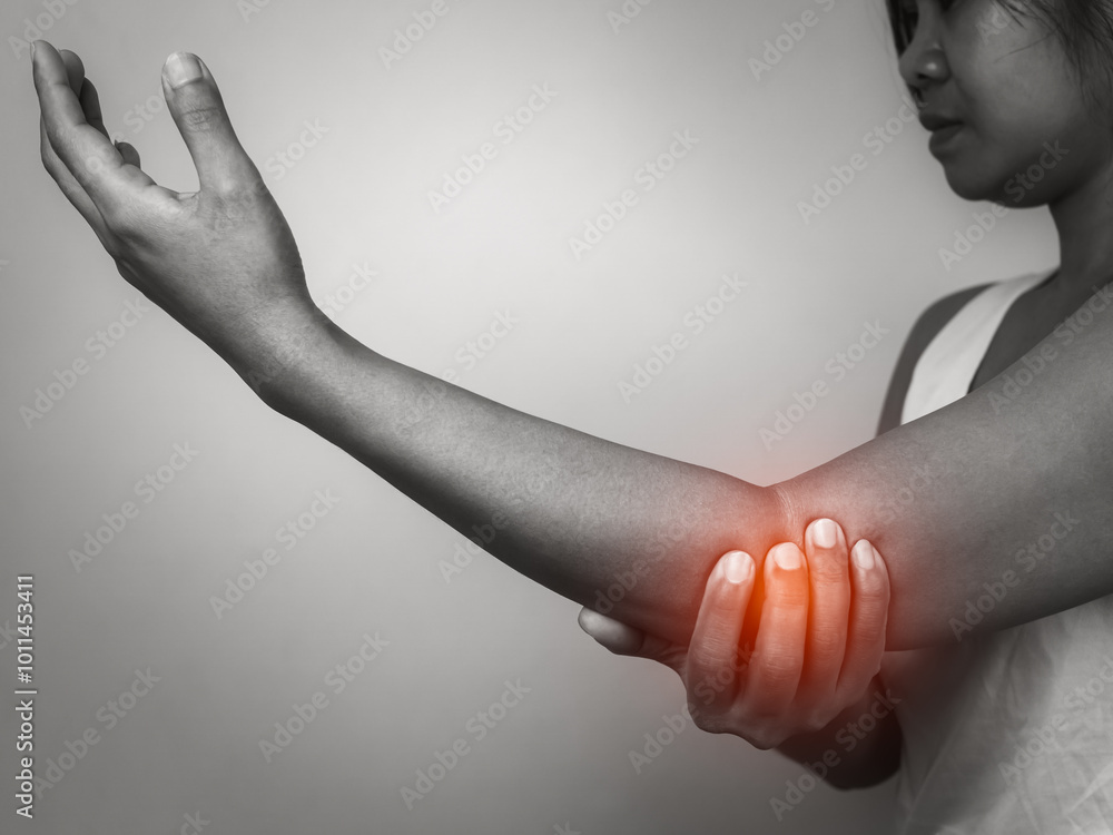 Woman with acute pain elbow with arm pain on gray background, Elbow and ...