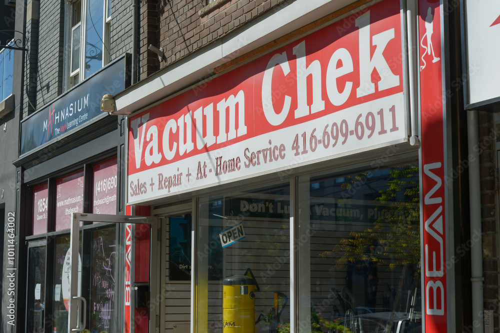 exterior building and sign of Vacuum Chek, a vacuum cleaner store ...