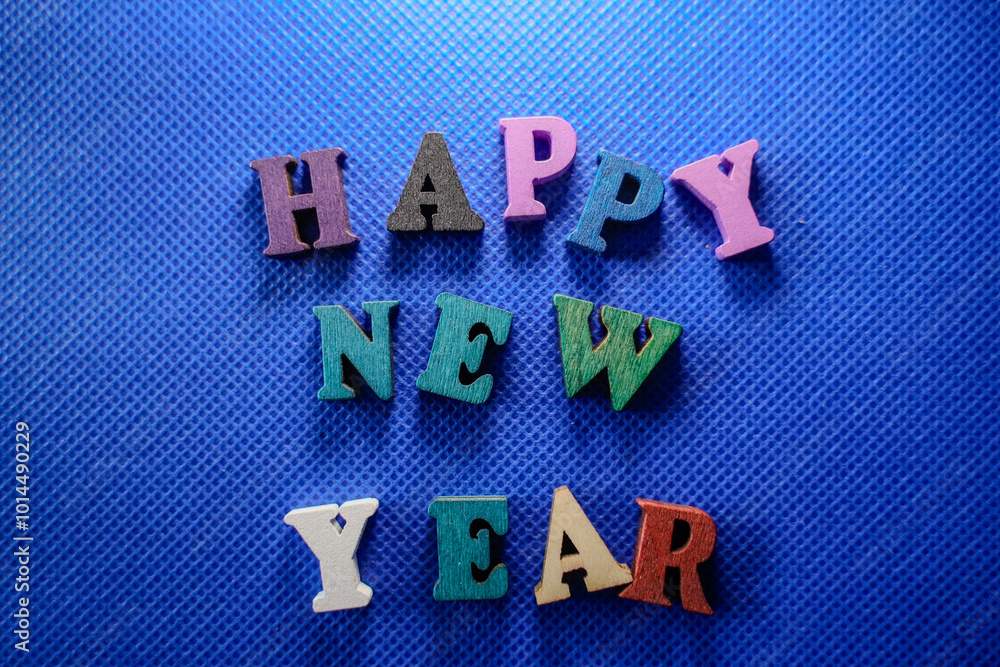 New year, in colorful letters, with a blue background, to congratulate ...