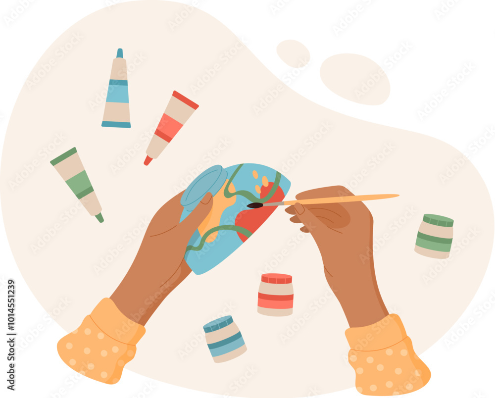 Hands create colorful art using various tools in a craft activity ...