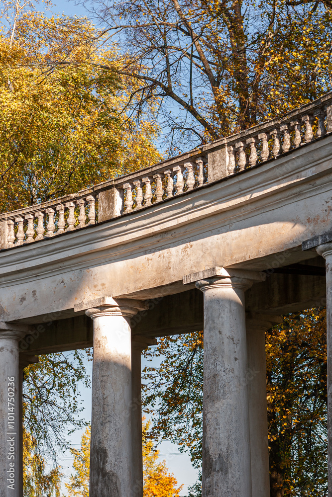 The image shows a neoclassical colonnade under restoration, with ...