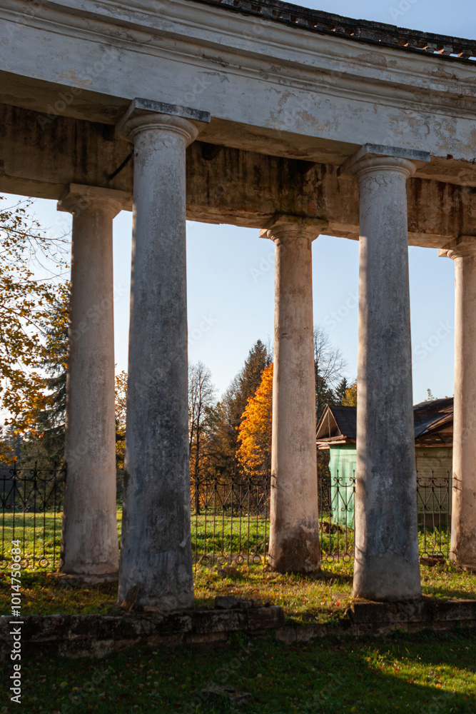 The image shows a neoclassical colonnade under restoration, with ...