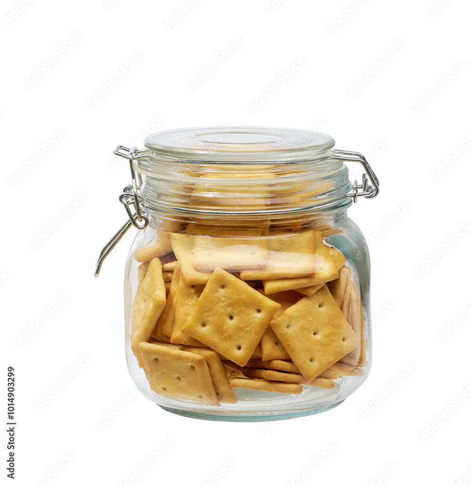 Salted crackers square shape in a clear glass jar, isolated on white ...