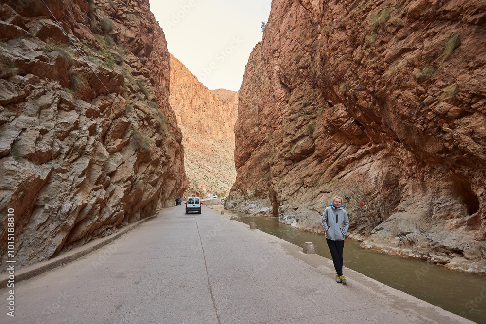hiking woman stopping and enjoying the view of the gorges of Dad s in the canyons of Atlas in ...