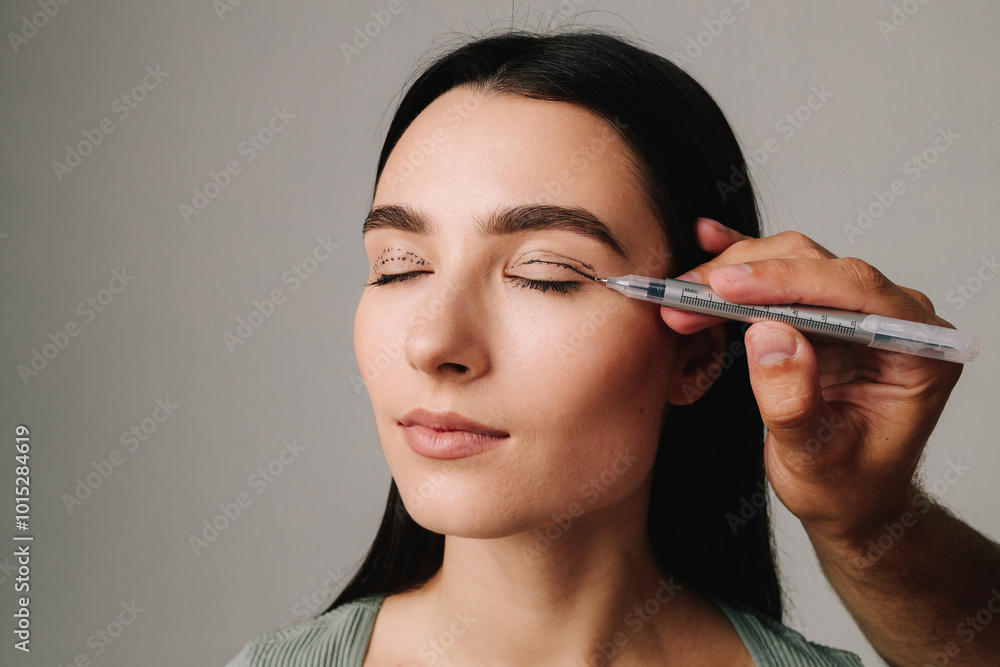 Blepharoplasty markup close-up on the face before the plastic surgery ...