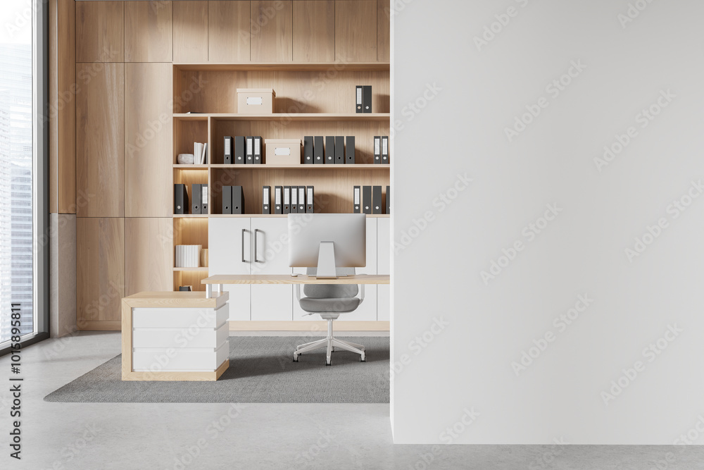 Modern office interior featuring wooden shelves with binders and a ...