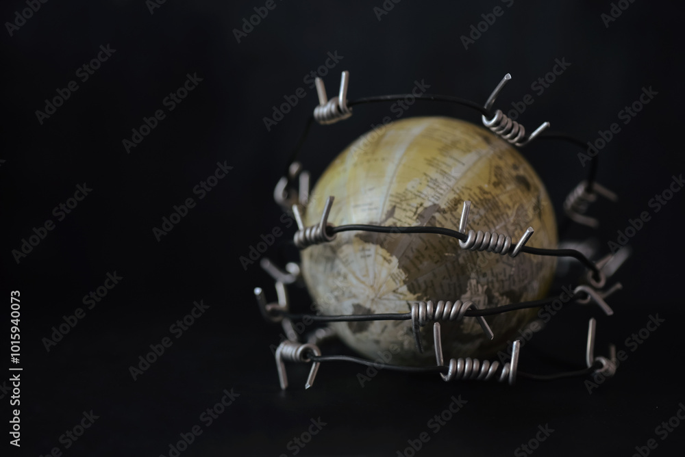 War barbed wire (razor wire, Concertina wire;) surround on the blur ...