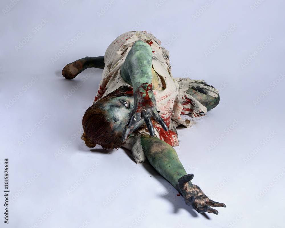 portrait of scary female model wearing spooky halloween costume, ripped ...